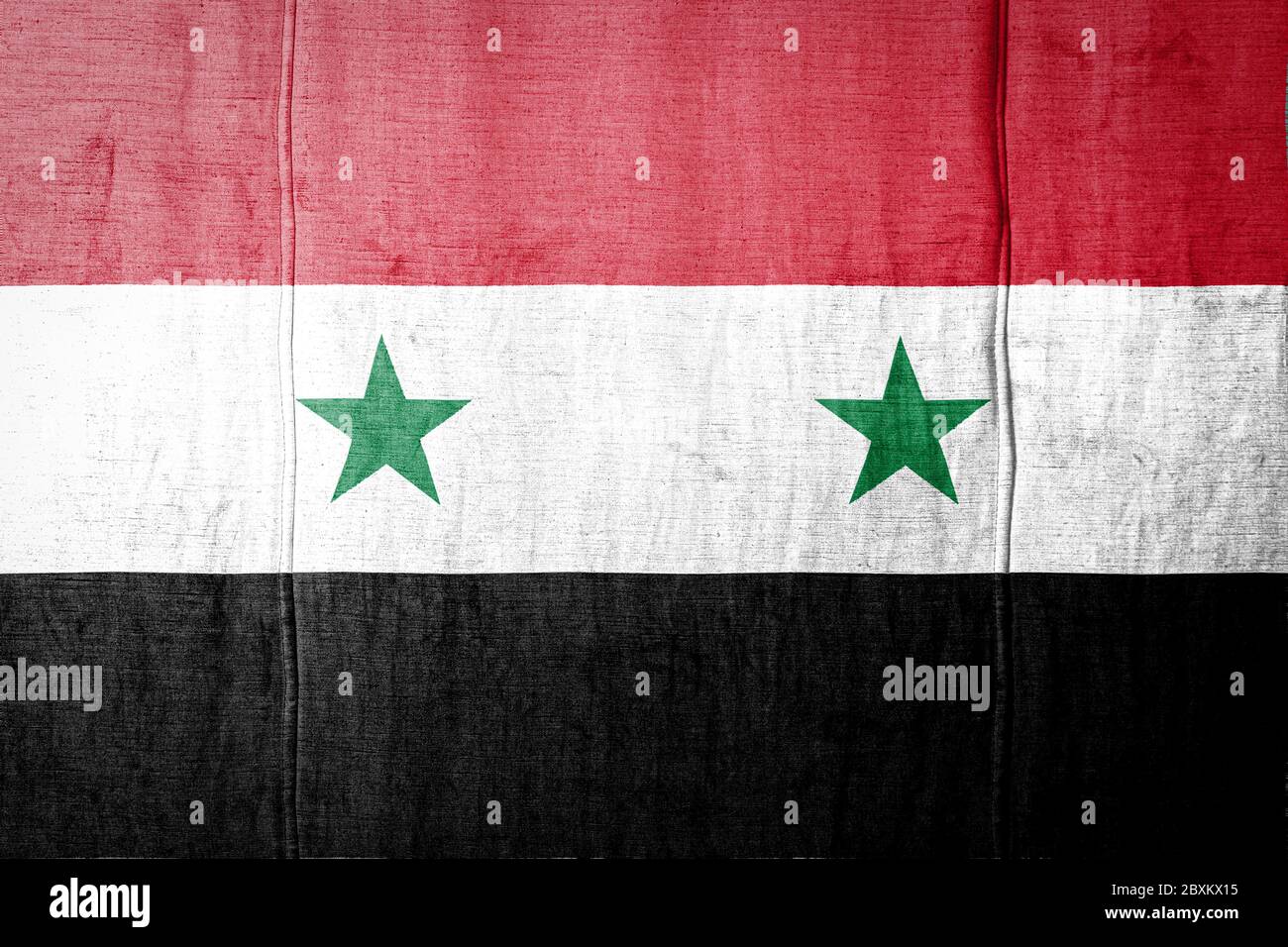 National flag of Syria depicting in paint colors on old textile. Flag ...