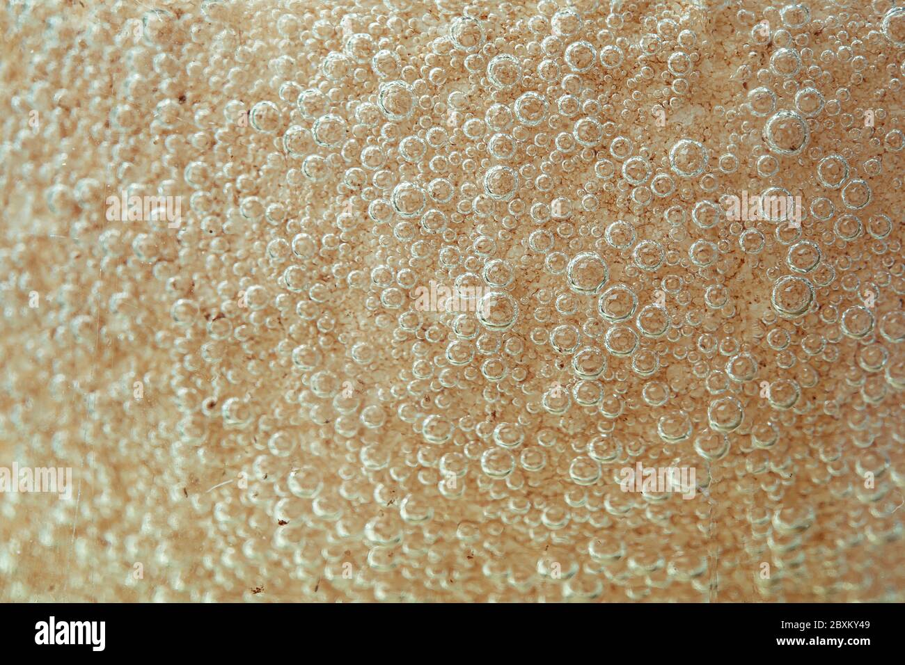 Tiny bubbles on a liquid background Stock Photo - Alamy