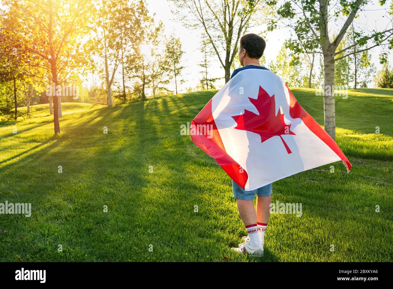 Canadian man holding canadian flag hi-res stock photography and images ...