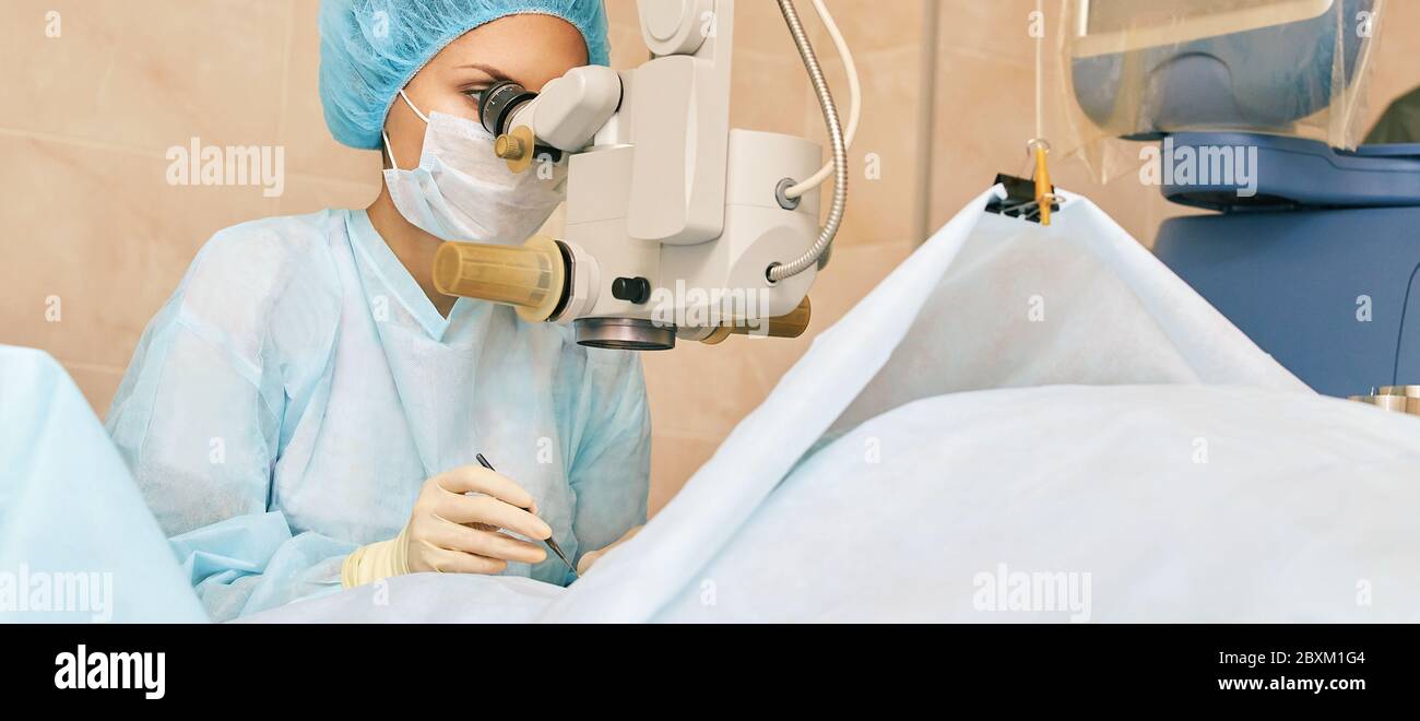 Ophthalmology laser microscope operation. Doctor in clinic. Patient eye ...