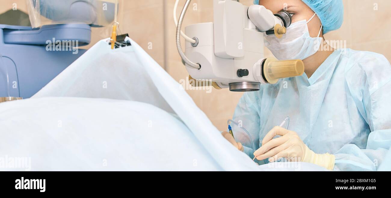Ophthalmology laser microscope operation. Doctor in clinic. Patient eye ...