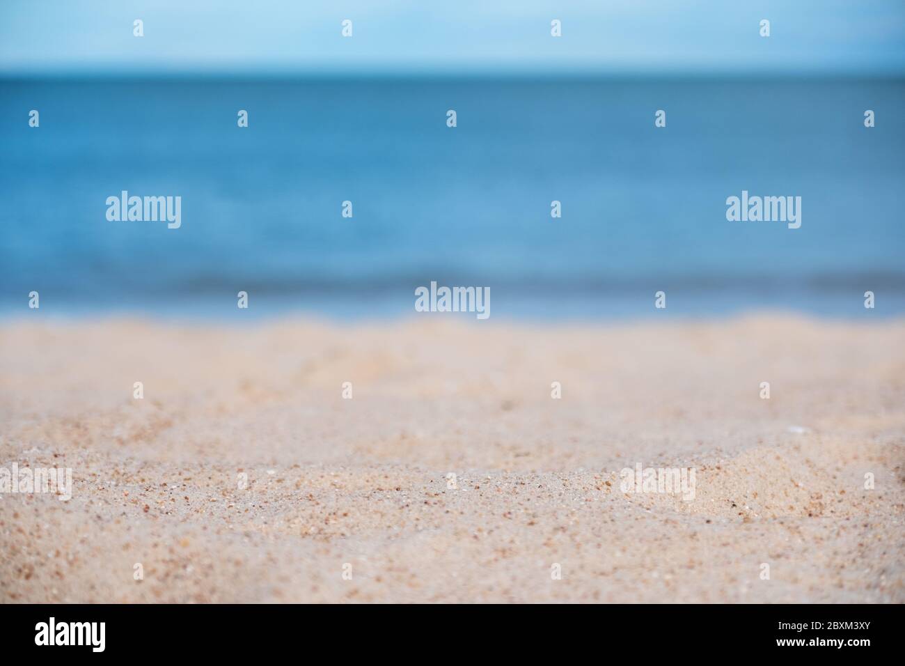Landscape image of sand on tropical beach with blue sea and sky ...