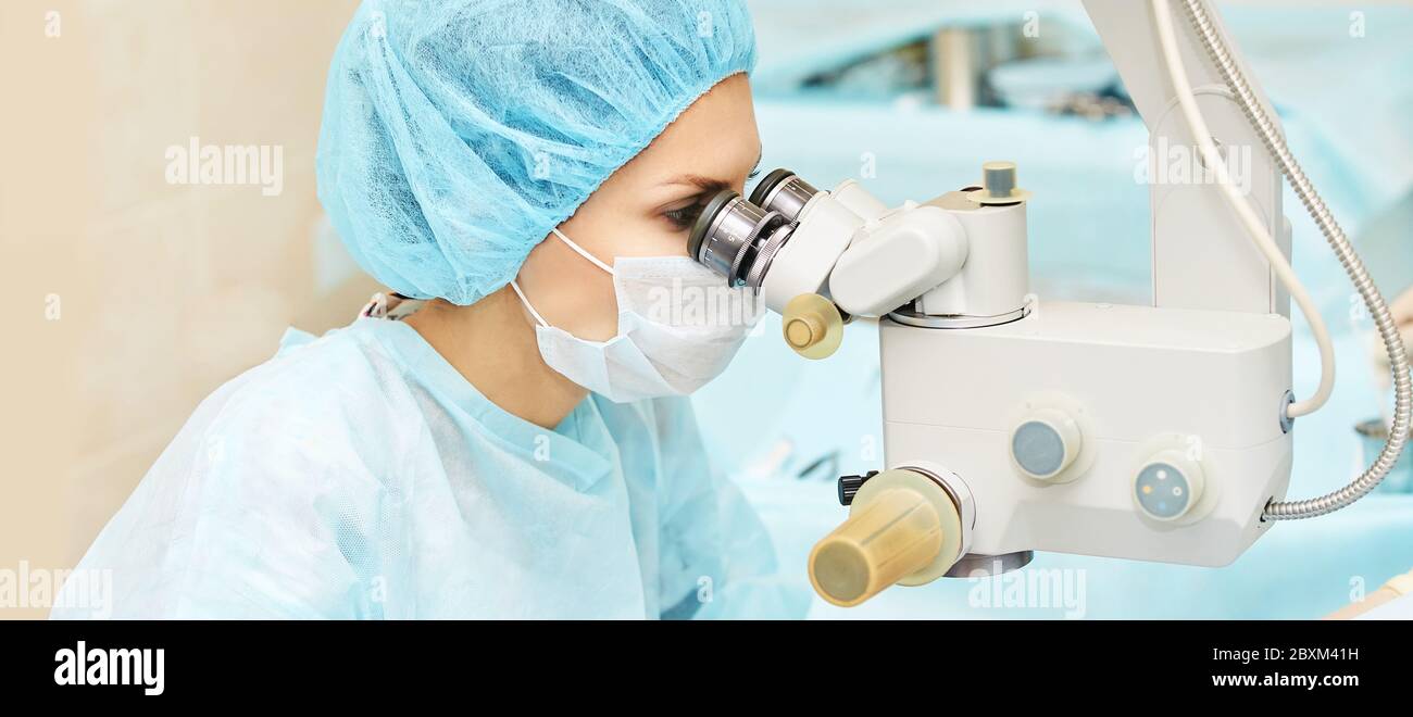 Ophthalmology laser microscope operation. Doctor in clinic. Patient eye ...