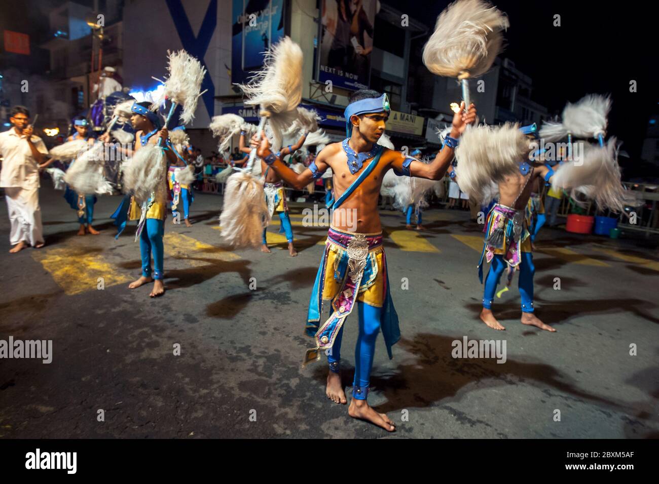Chamara Dancers perform along the streets of Kandy in Sri Lanka during ...