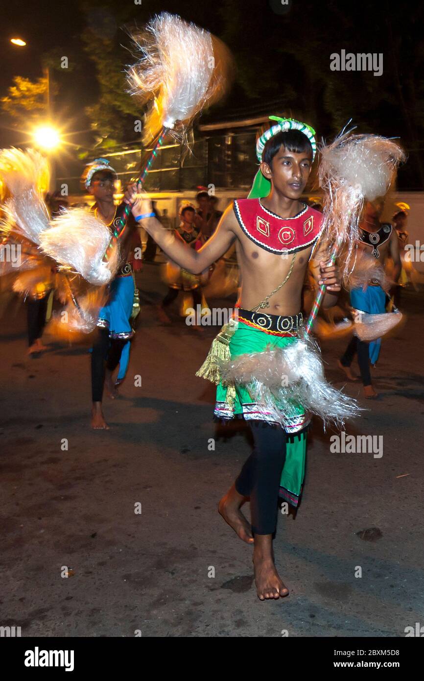 Chamara Dancers perform along a street of Kandy, Sri Lanka during the ...