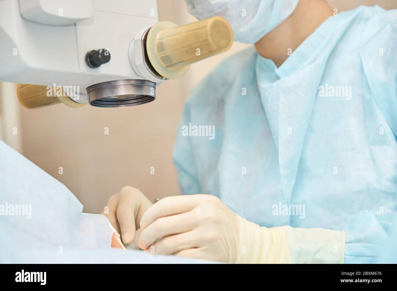 Ophthalmology laser microscope operation. Doctor in clinic. Patient eye ...