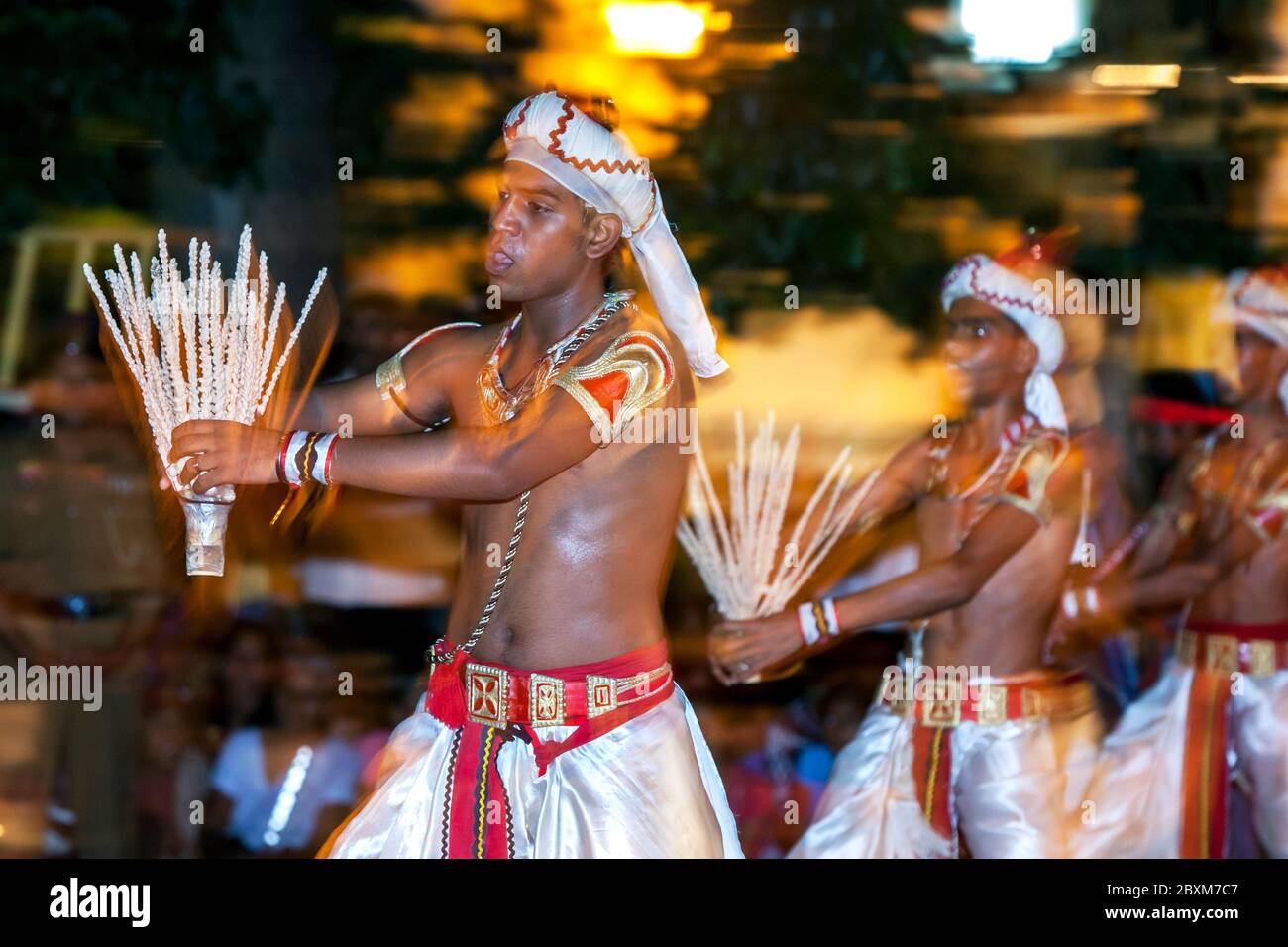 Coconut Flower Dancers perform on the streets of Kandy during the Esala ...