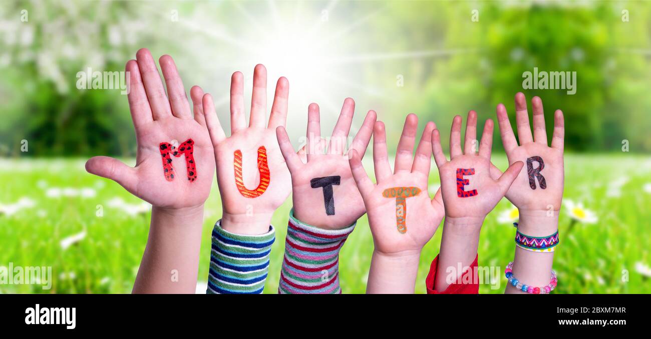 Children Hands Building Word Mutter Means Mother, Grass Meadow Stock ...