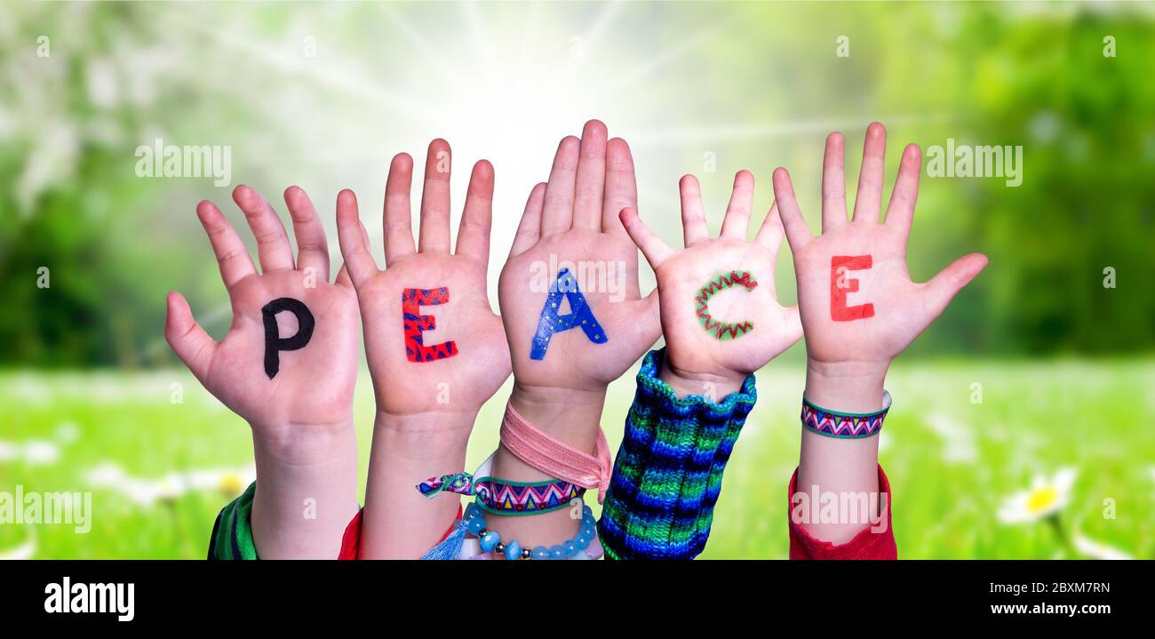 Children Hands Building Word Peace, Grass Meadow Stock Photo - Alamy