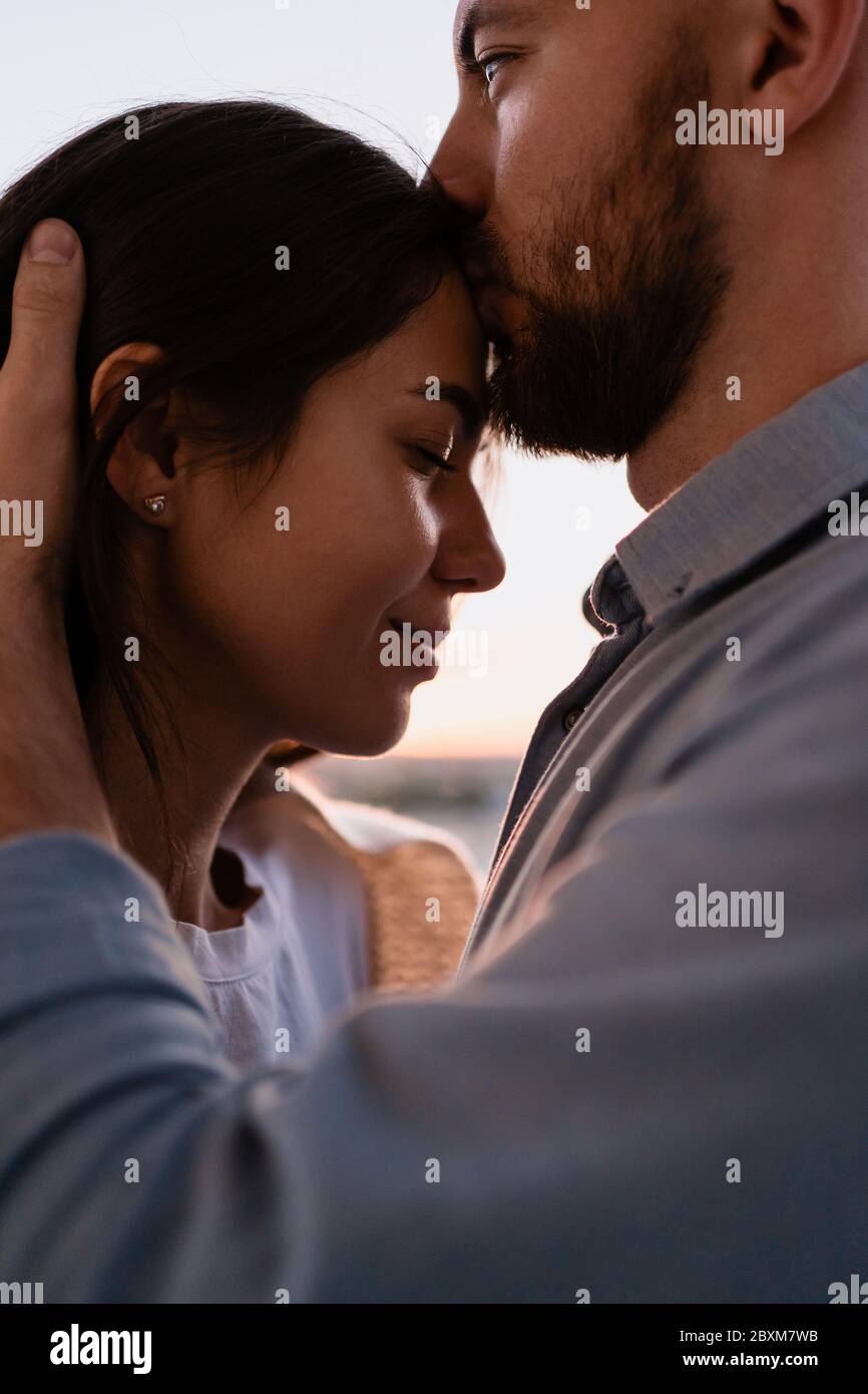 Portrait lovely couple hugging each other, smiling, enjoying time ...