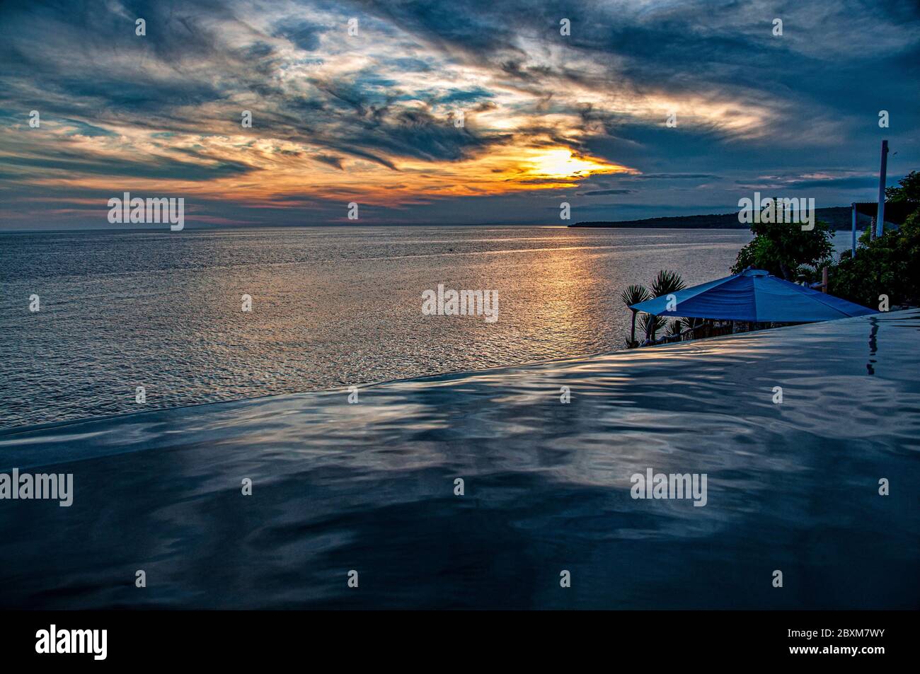 Sunset from pool in Bira Beach, Sulawesi, one of the four Great Sunda ...