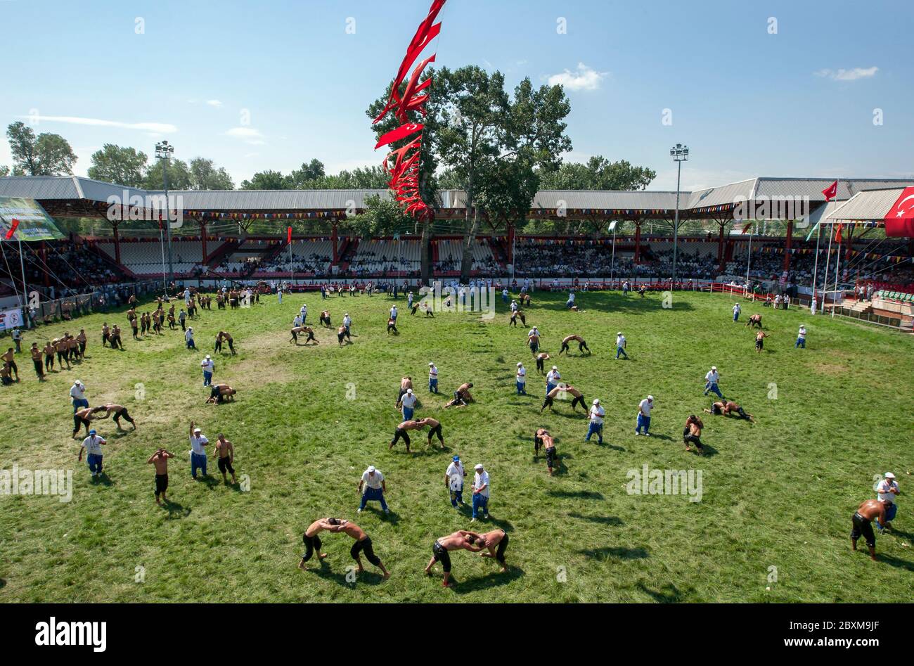 Wrestlers cover the arena at the Kirkpinar Turkish Oil Wrestling ...