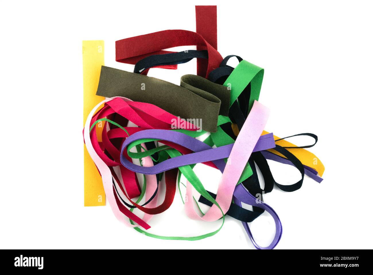 Multi-colored strips of felt fabric on white background. A kind of felt ...