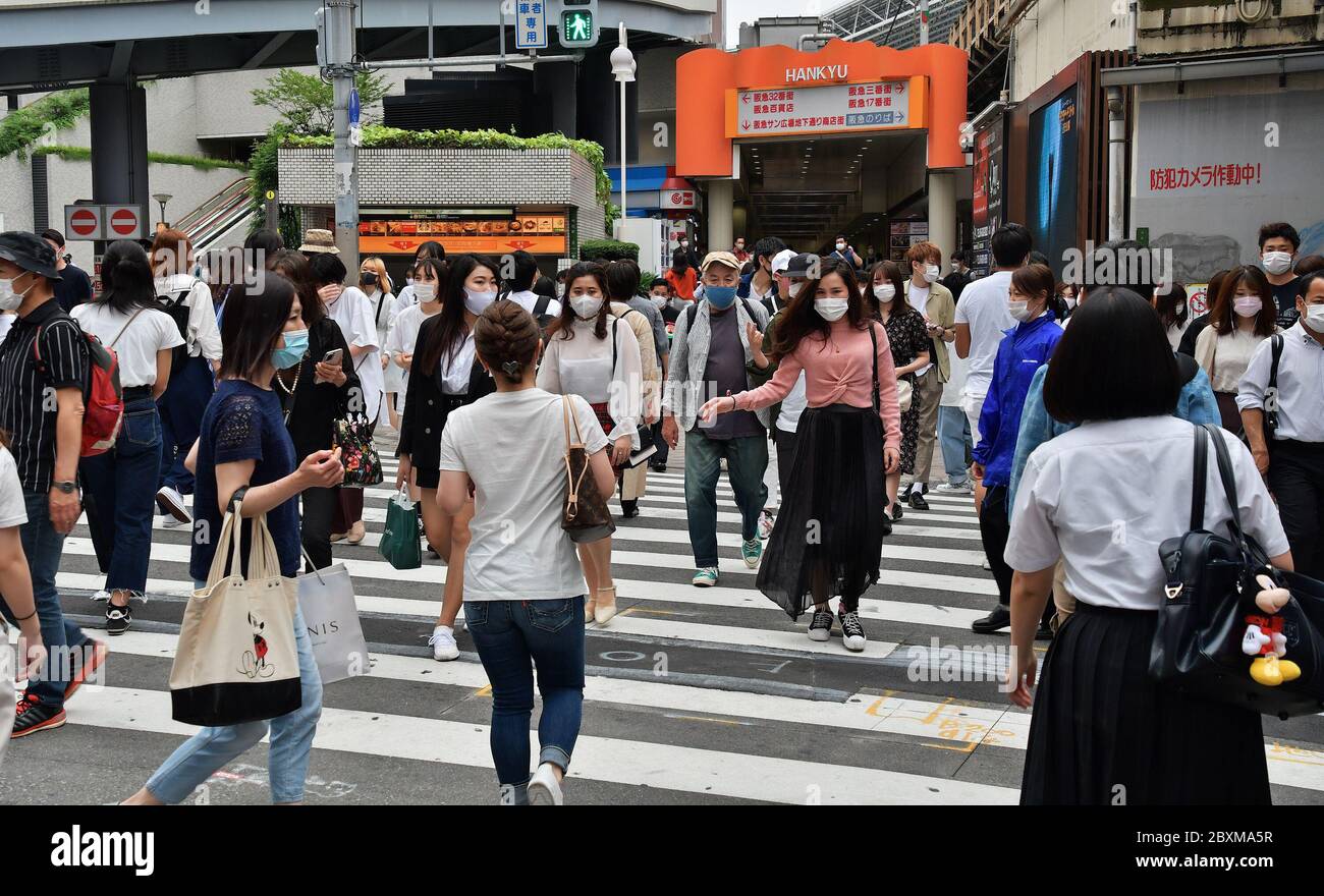 Pedestrians wearing face masks walk near the shopping mall HEP Five at ...
