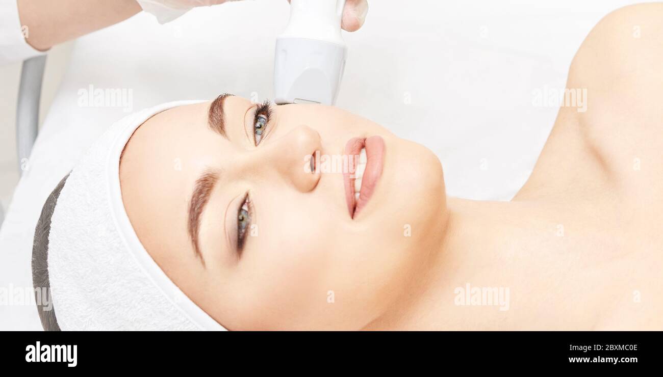 Vacuum face cosmetology equipment. Facial salon cleaning. Youn girl ...