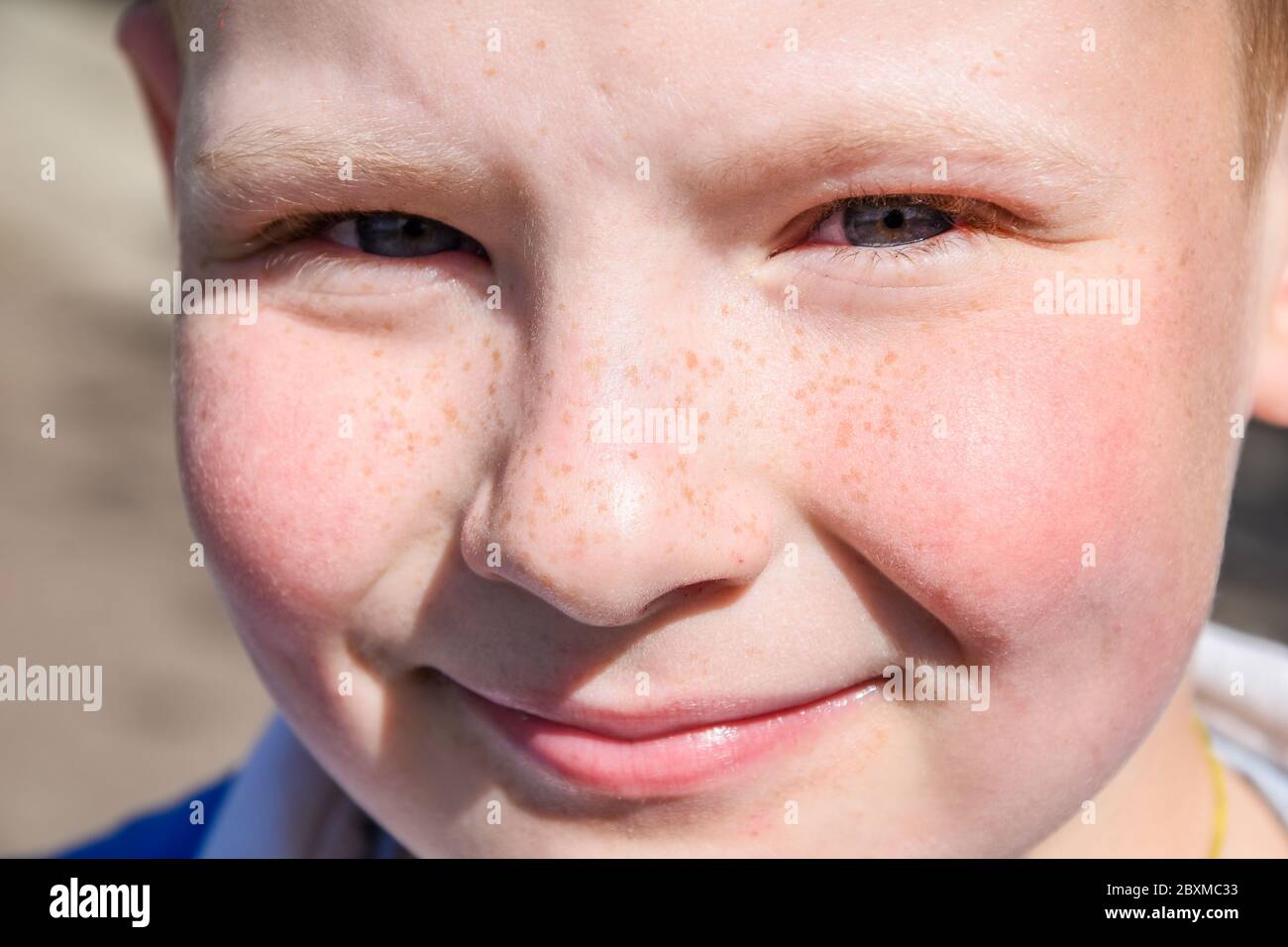 little kid with furious blue eyes for childhood rebellion, freckle ...