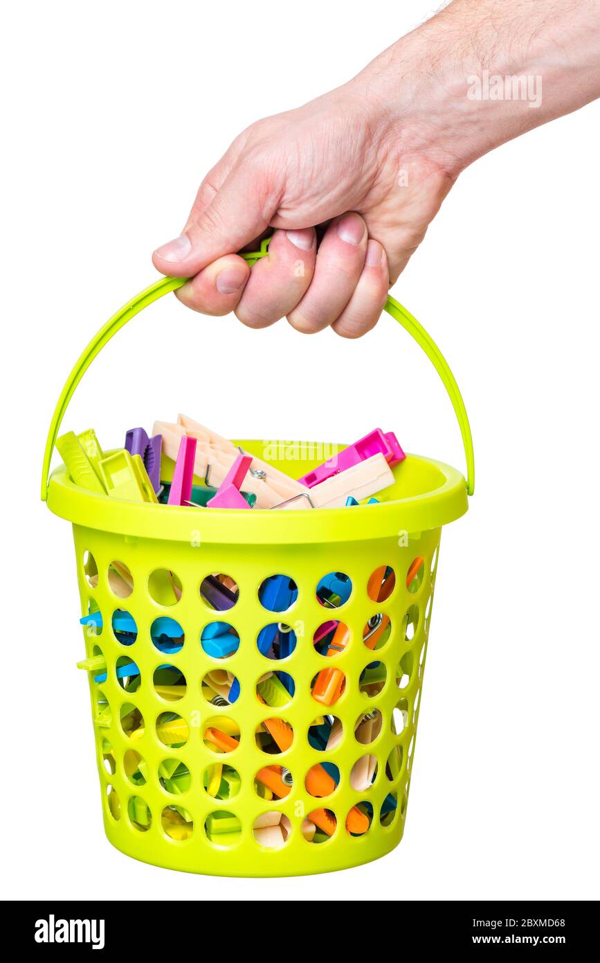 Hand hold bucket with clothespin Stock Photo - Alamy