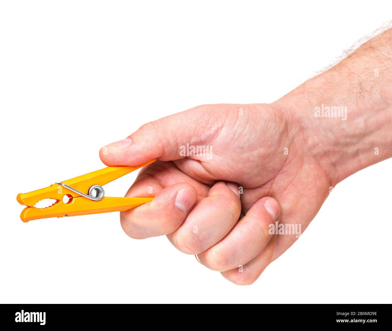 Hand with color clothespin Stock Photo - Alamy