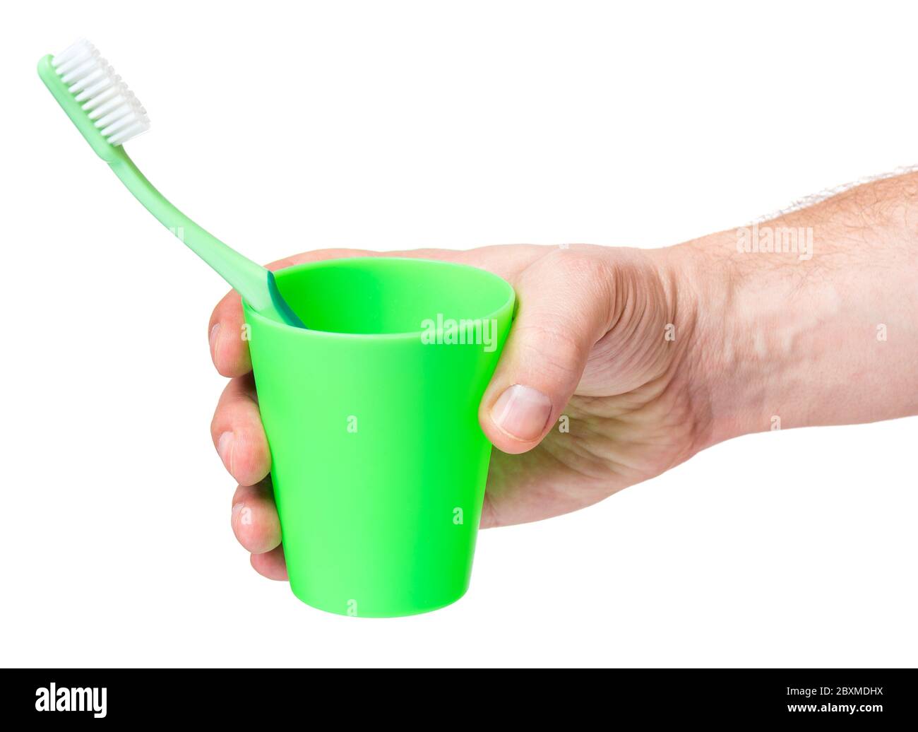 Hand with toothbrush on white Stock Photo - Alamy