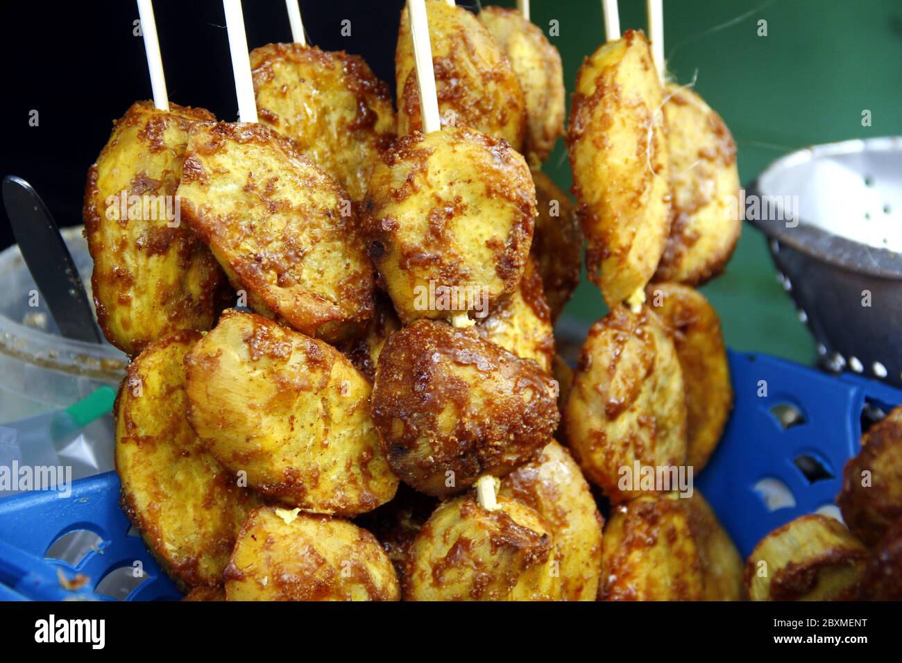 Photo of freshly cooked Filipino snack food called Kamote Cue or deep ...
