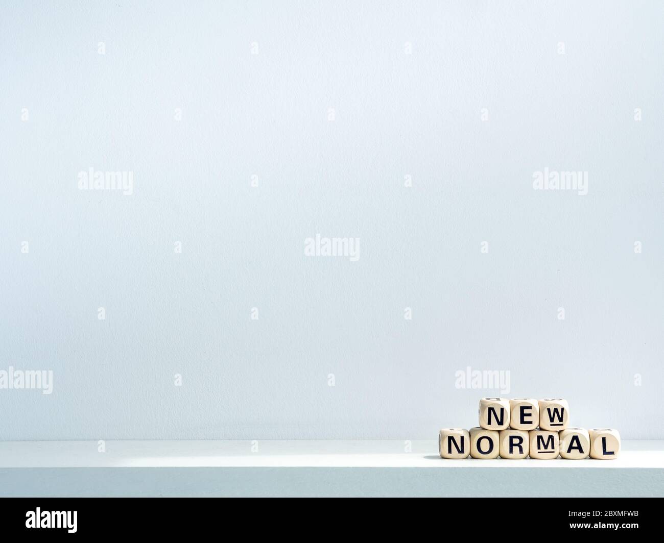 New Normal, words on wooden alphabet cube on shelf on white background ...