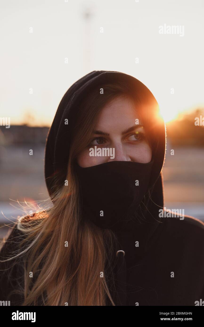 Pretty girl in black medical mask Stock Photo - Alamy
