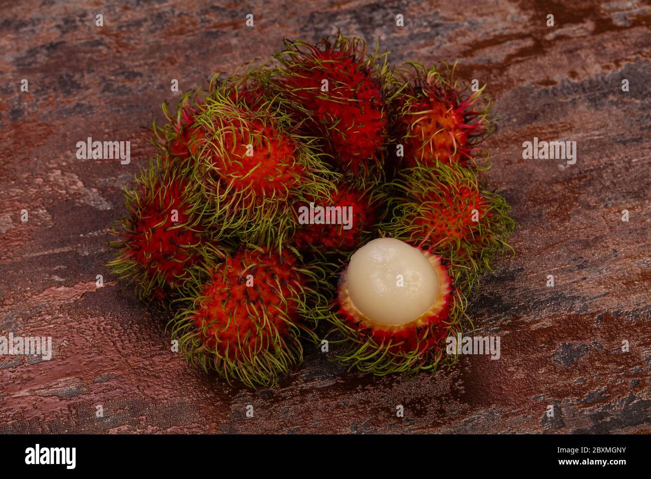 Tropical sweet exotic fruit Rambutan heap Stock Photo - Alamy