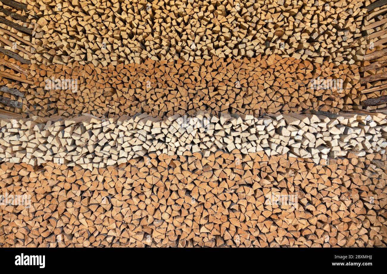 Huge pile of wood with pattern of different colors Stock Photo - Alamy