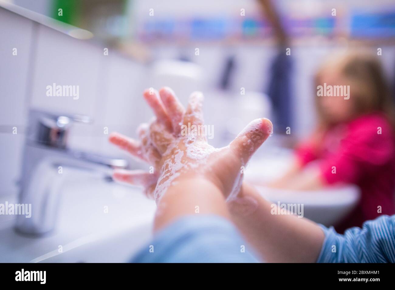 Cologne, Germany. 08th June, 2020. Children wash their hands with soap ...