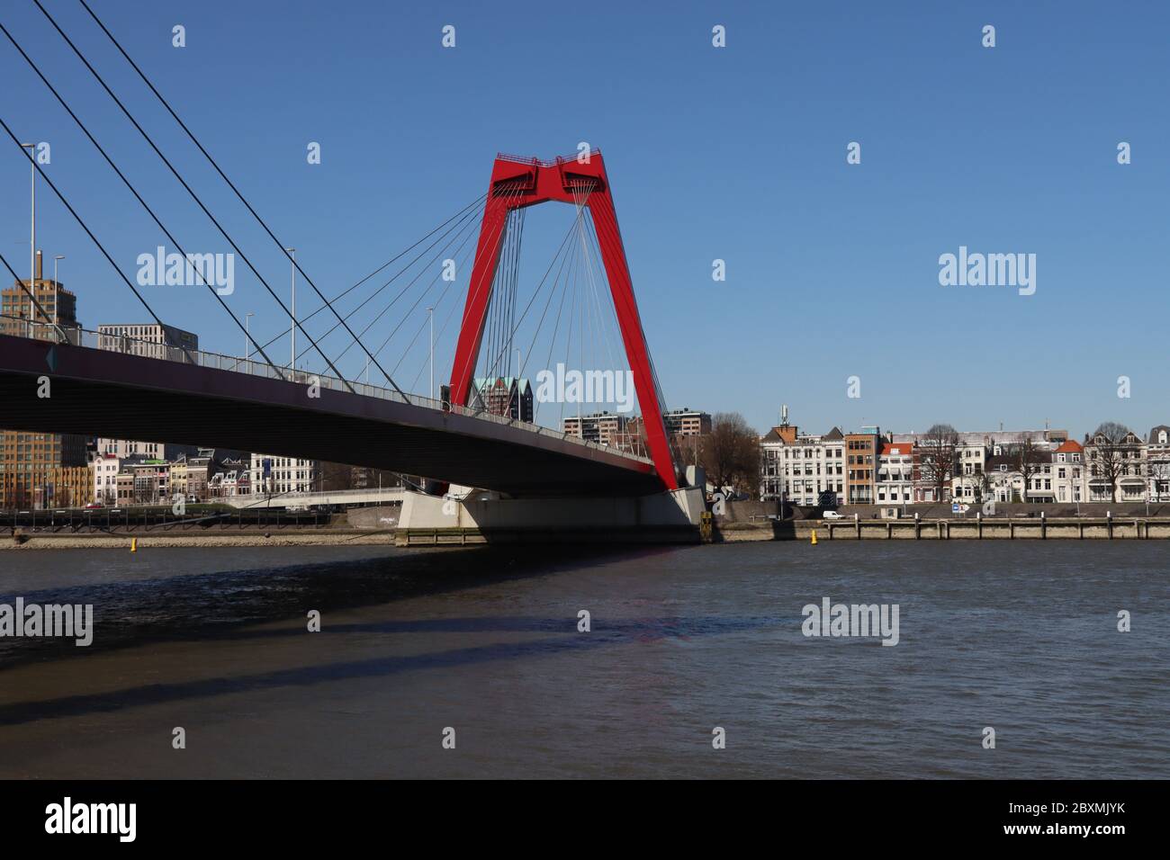 Steel bridge in red color called Willemsbrug in the center of Rotterdam ...