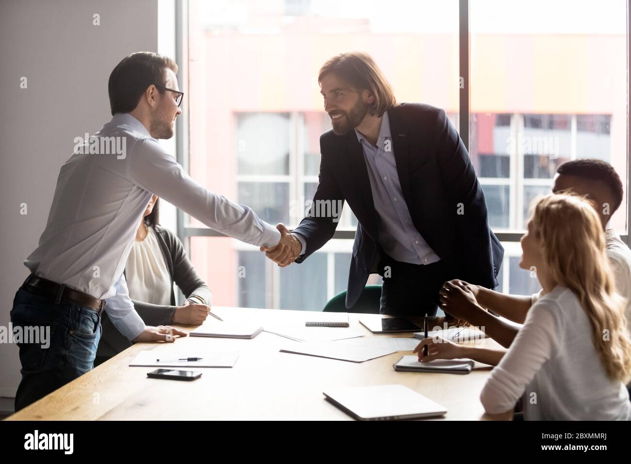 Negotiation starts with leaders of business parties shaking hands Stock ...