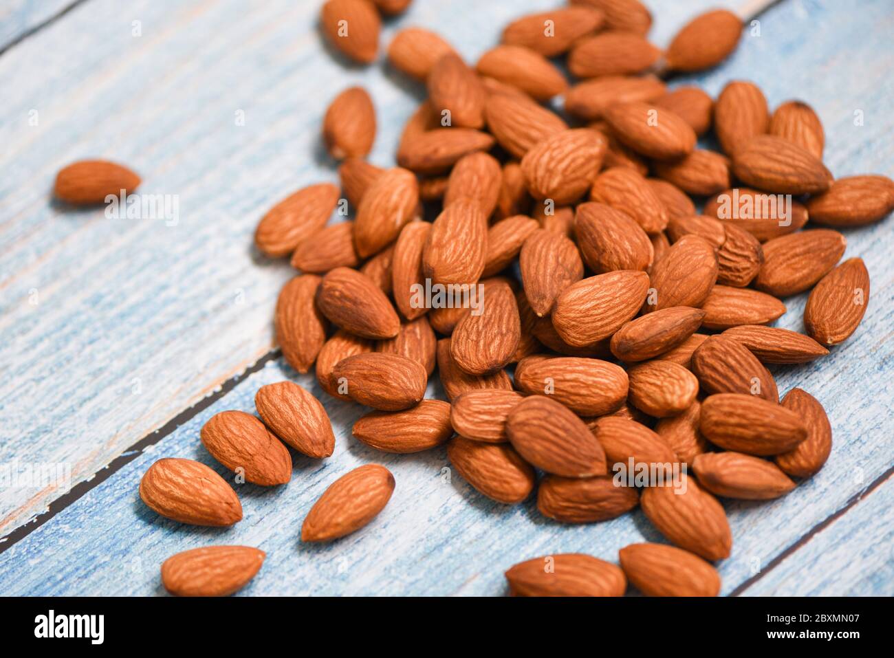 Roasted almond / Close up almonds nut on table background Stock Photo ...