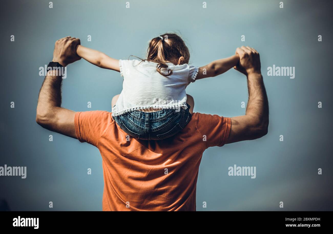 Family values. Father and daughter meet the sunset. He will put the ...