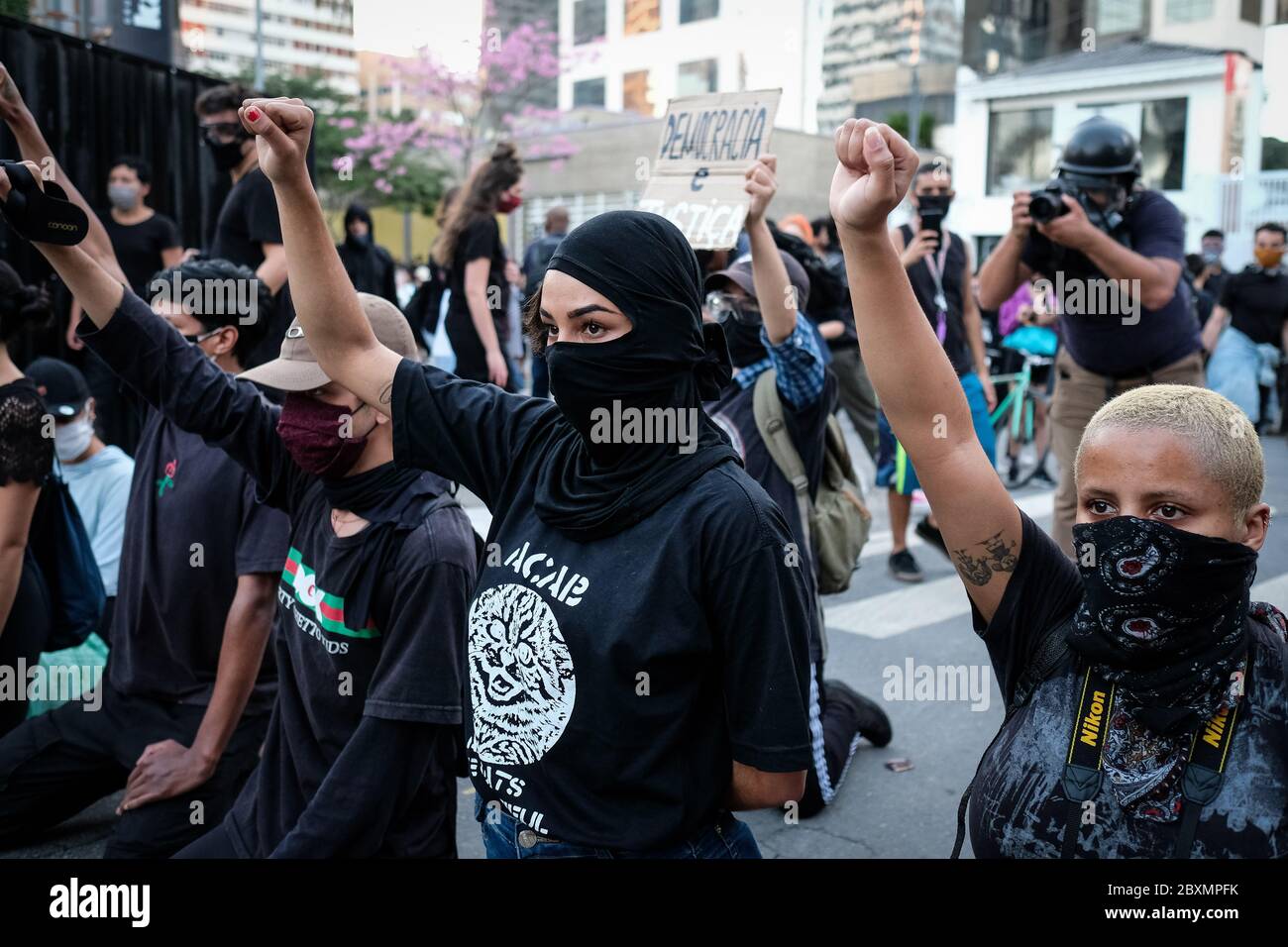 Sao Paulo, Brazil. 07th June, 2020. Demonstrators raise their fists ...