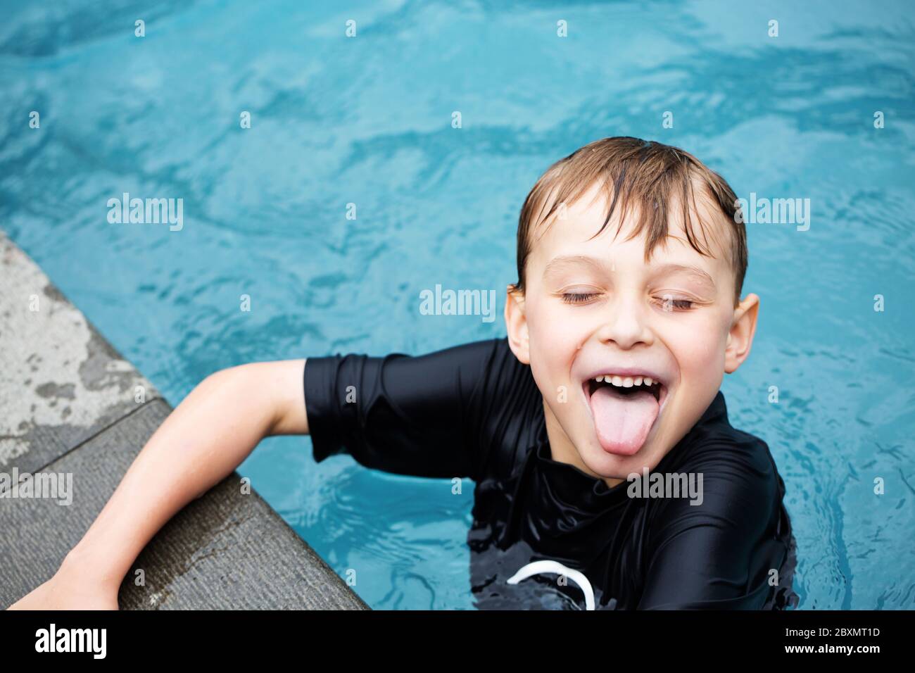 Portrait of boy sticking out tongue hi-res stock photography and images ...