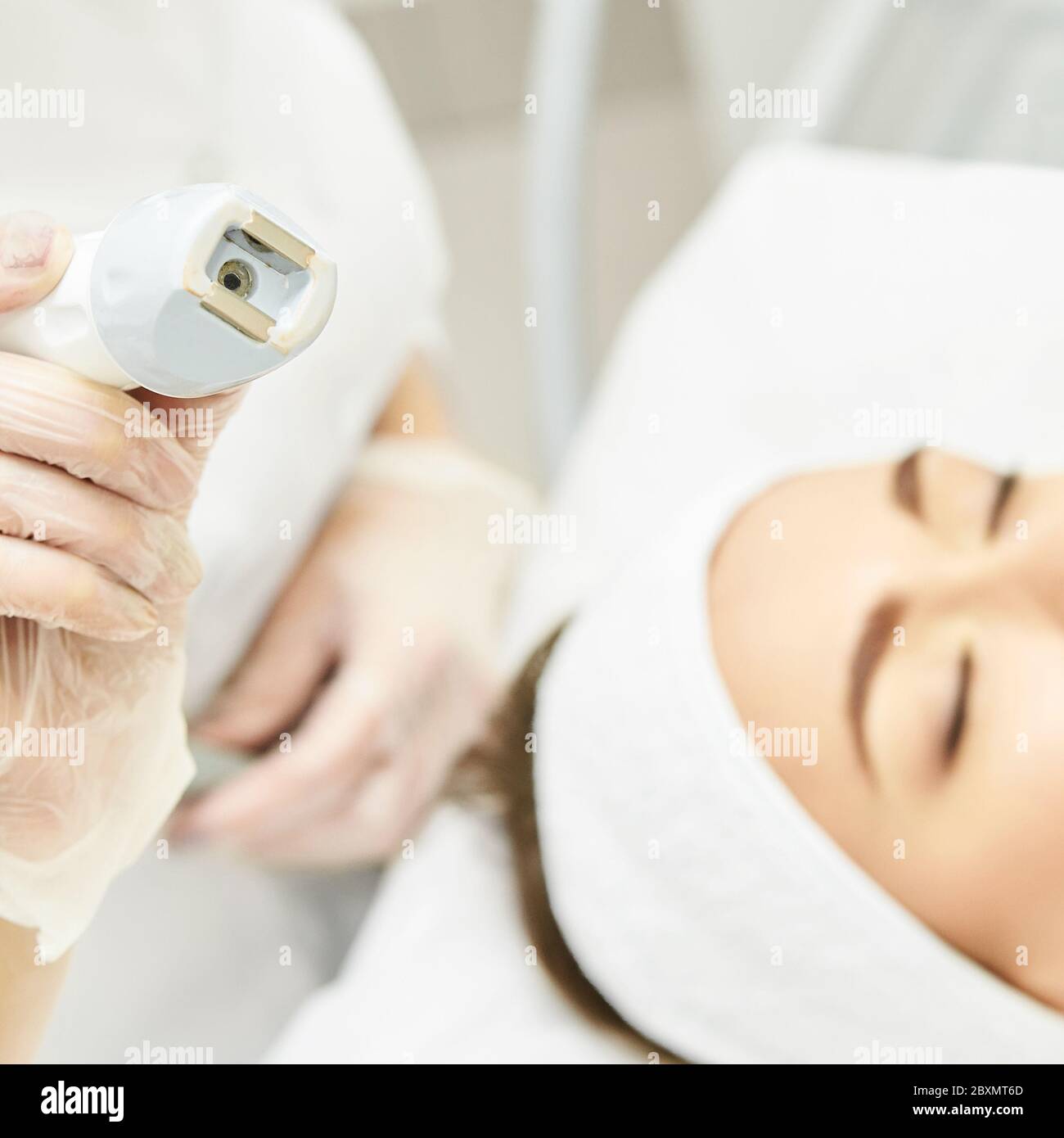 Vacuum face cosmetology equipment. Facial salon cleaning. Youn girl ...