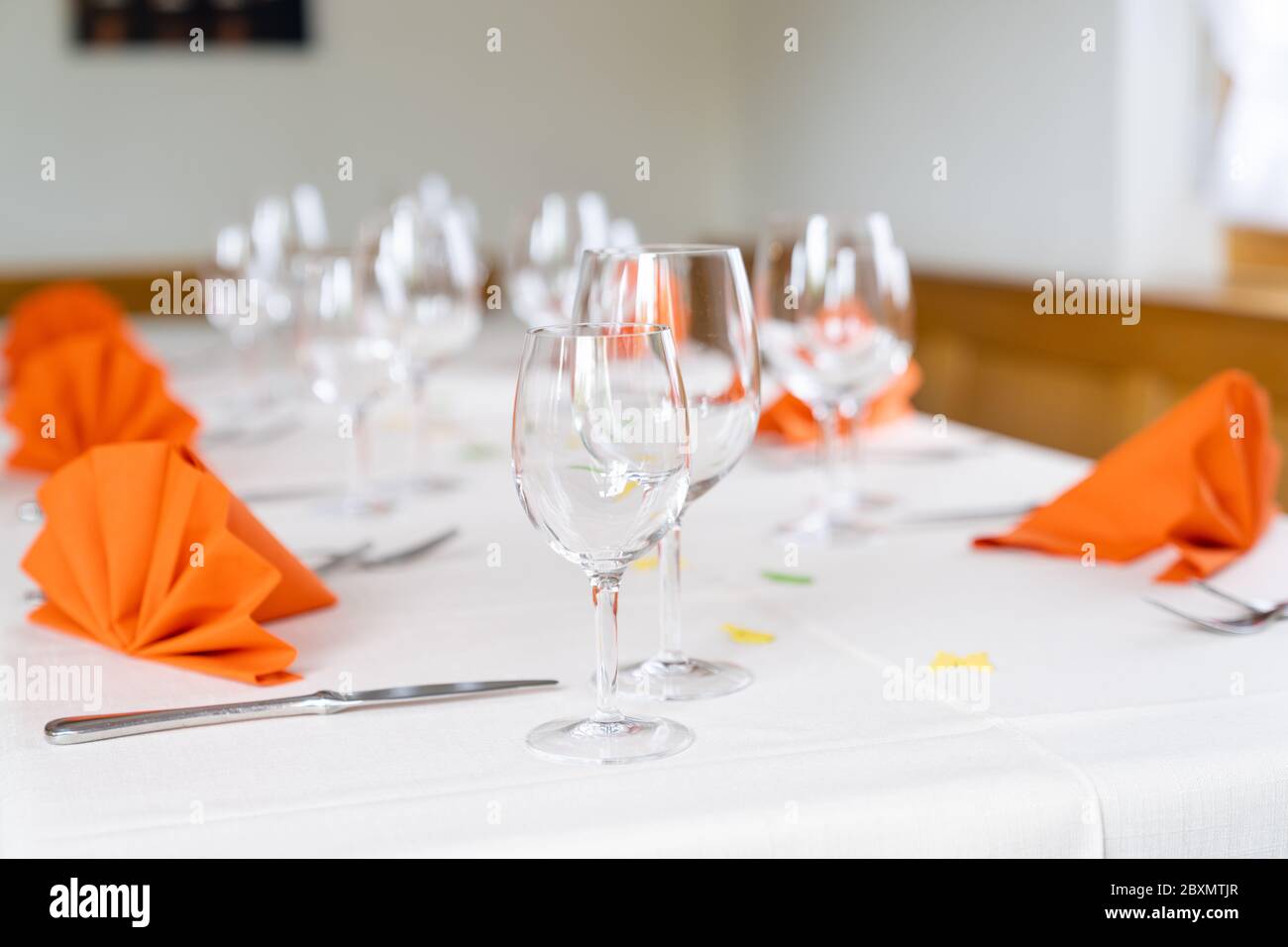 A charming and warm table and place settings interior shot of a ...