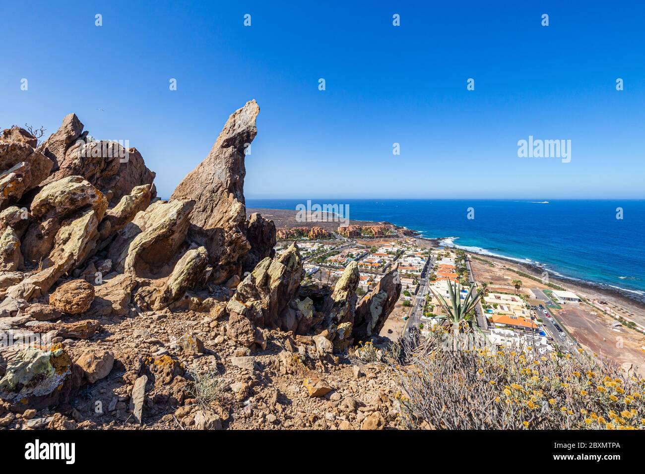 Landscape of volcanic hills with view on atlantic ocean and town of ...