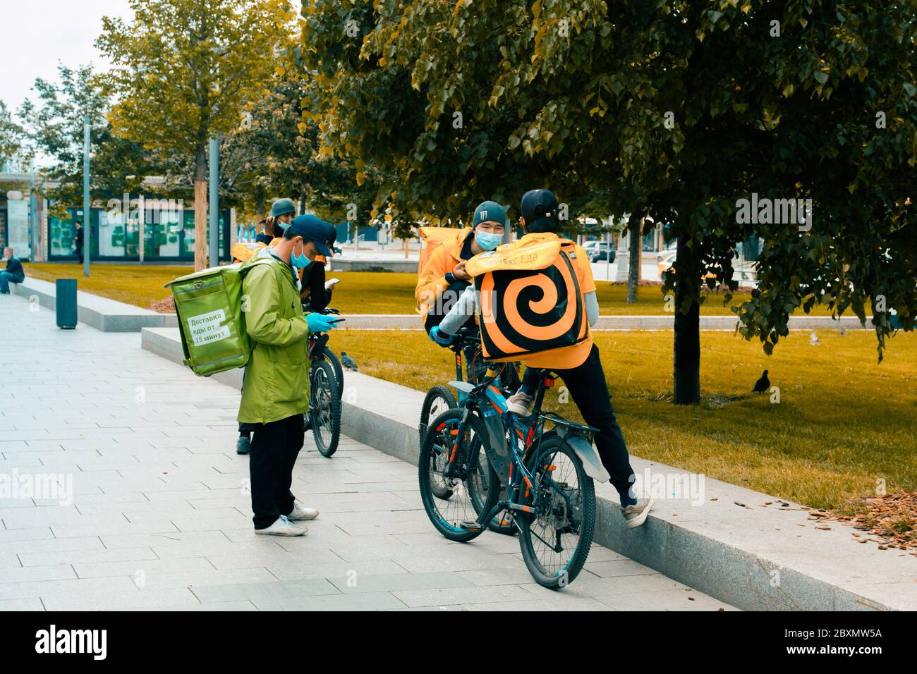 Takeaway food carriers on a Bicycle and foot couriers with an insulated ...