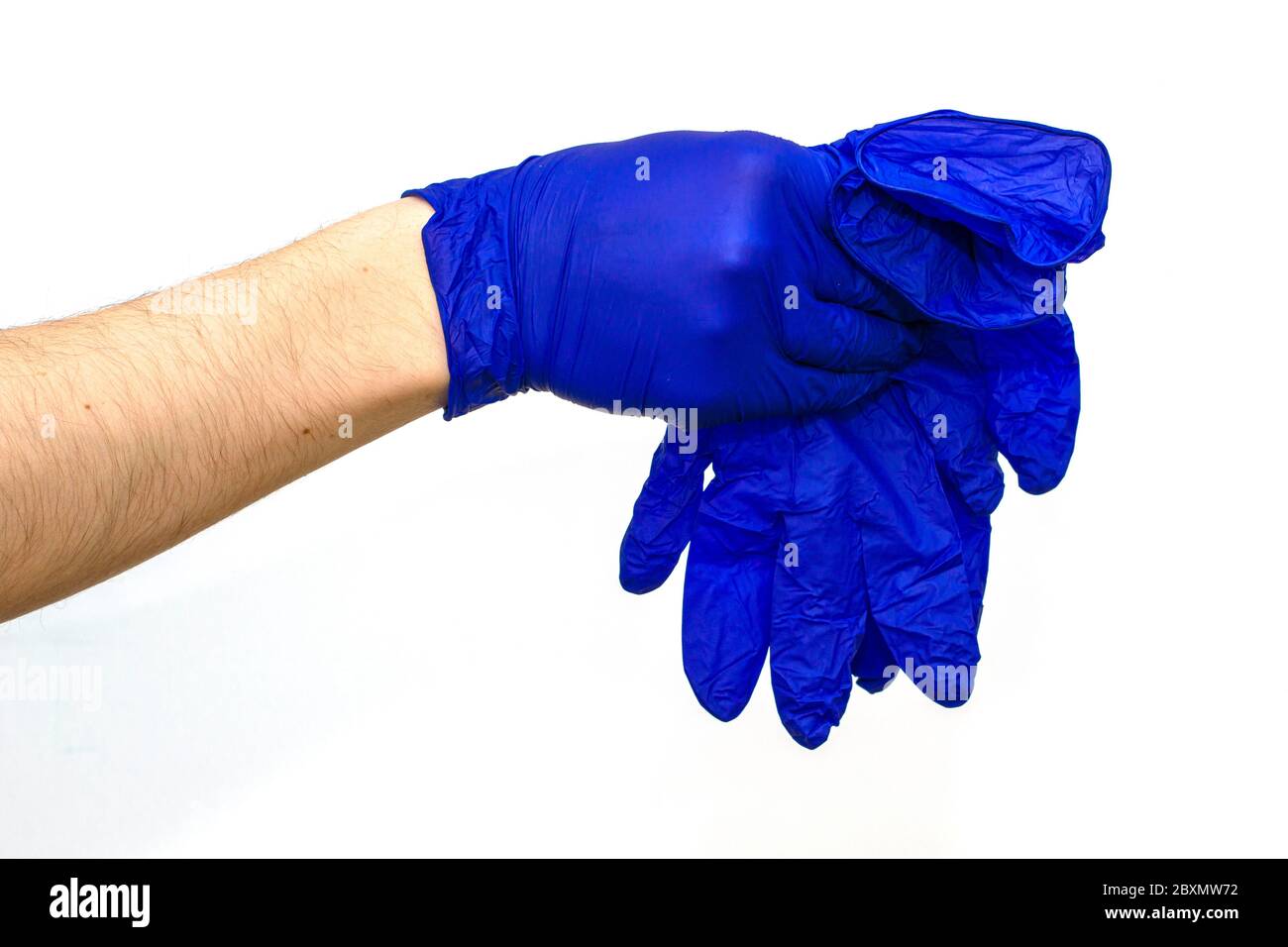 hand in a blue protective surgical glove shivers blue gloves on a white ...