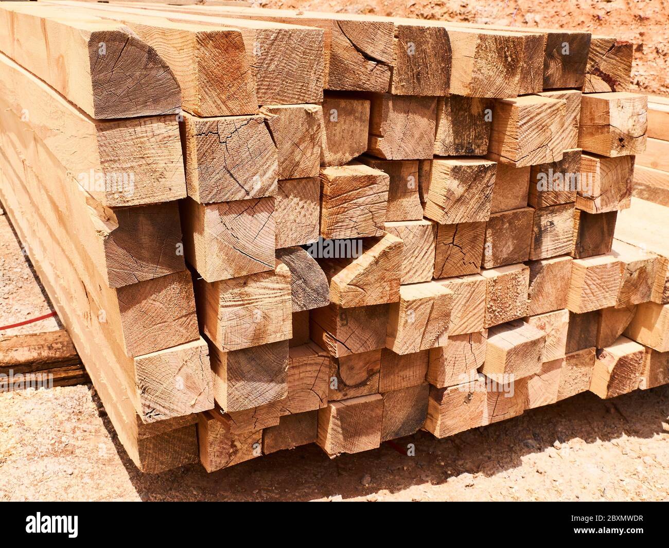 Stack of wooden squared beams background or texture concept Stock Photo ...