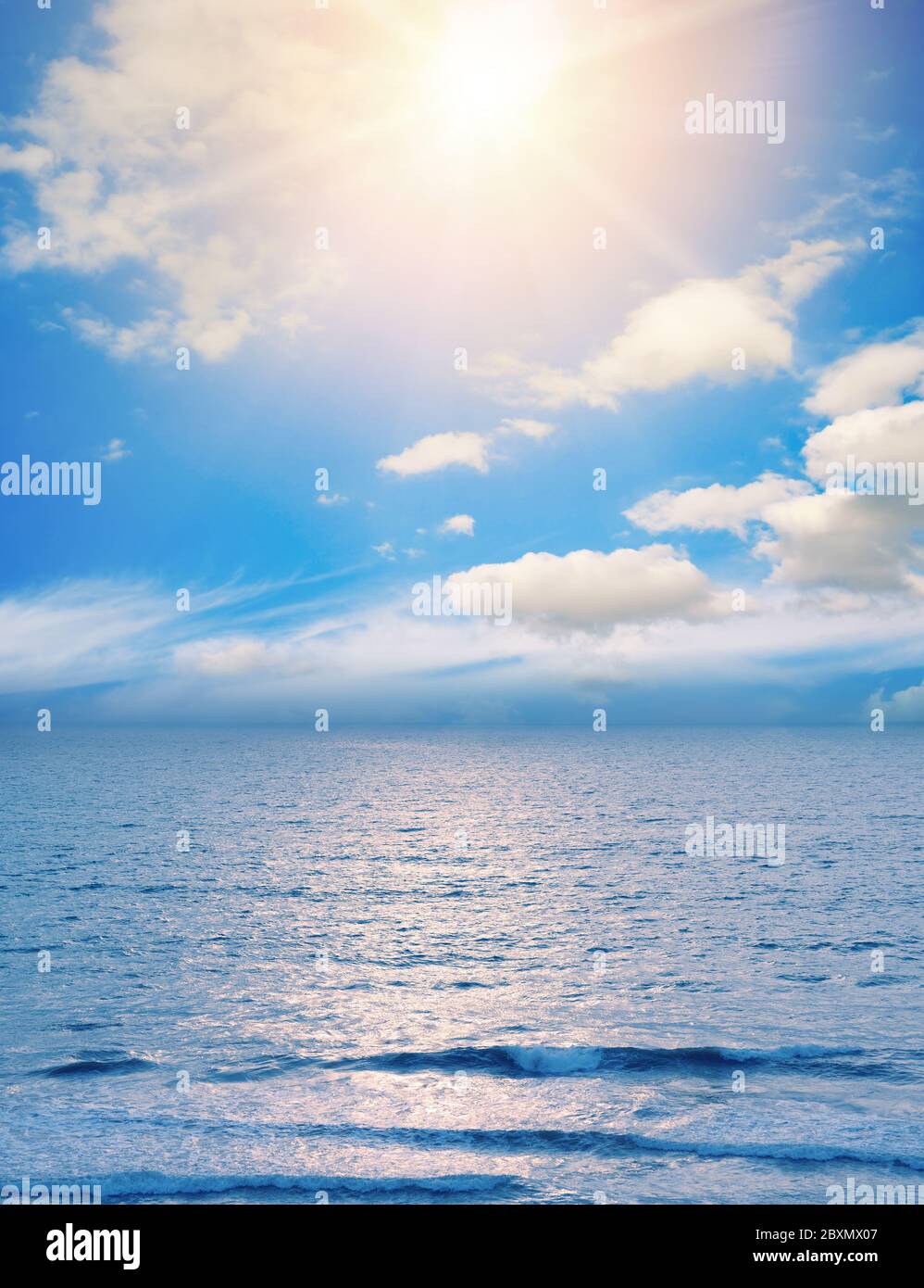 Fantastic landscape photo bright sun over blue ocean and sunny path ...