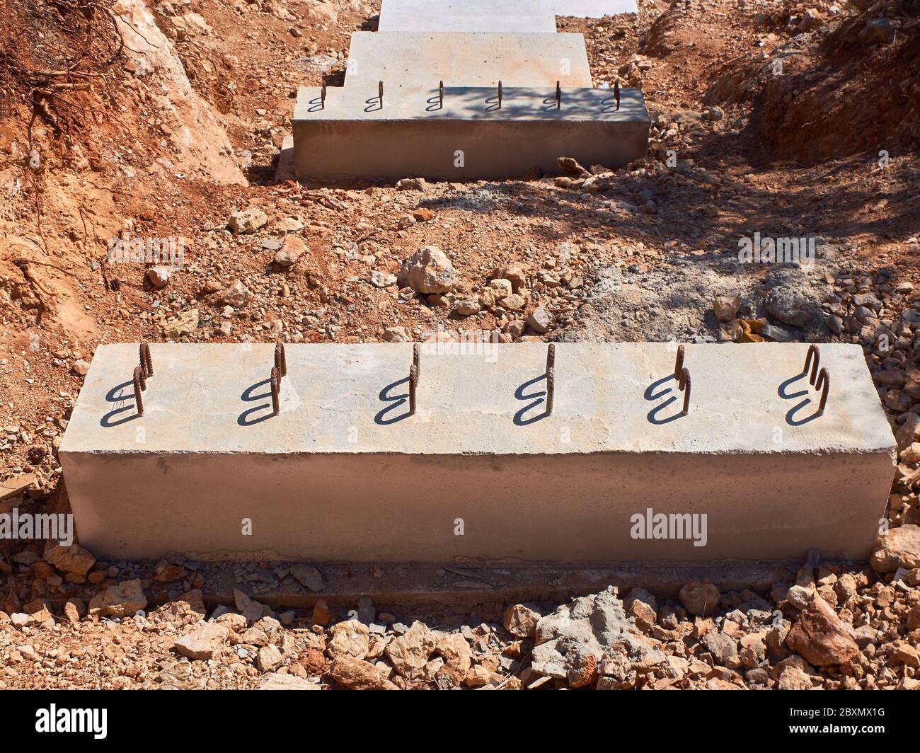Concrete foundations with metal reinforcement extensions in the trench ...
