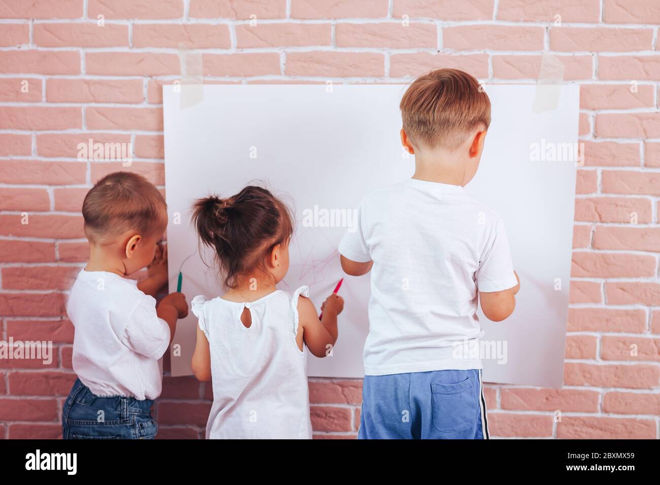 Little children draw on paper, home schooling, preschool education ...