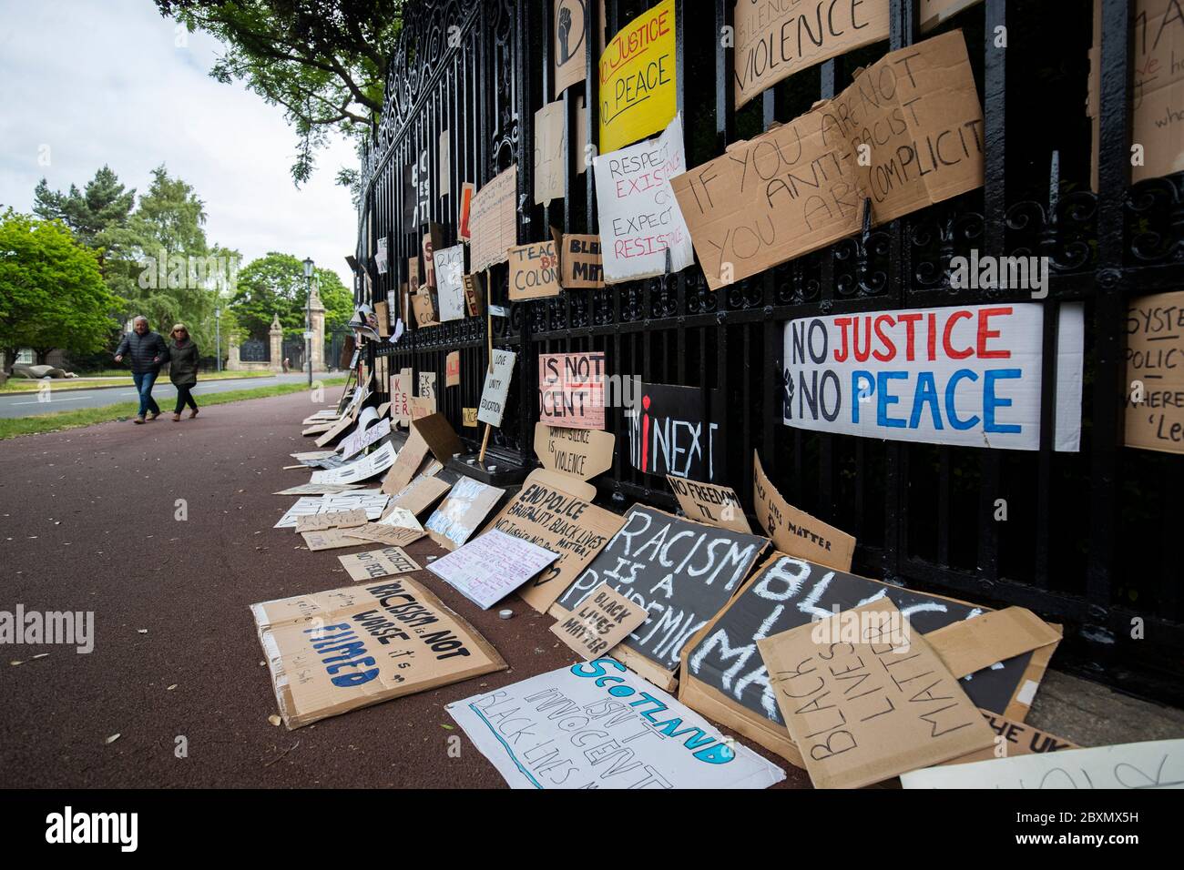 Placards and posters hung on the railings of the Palace of ...
