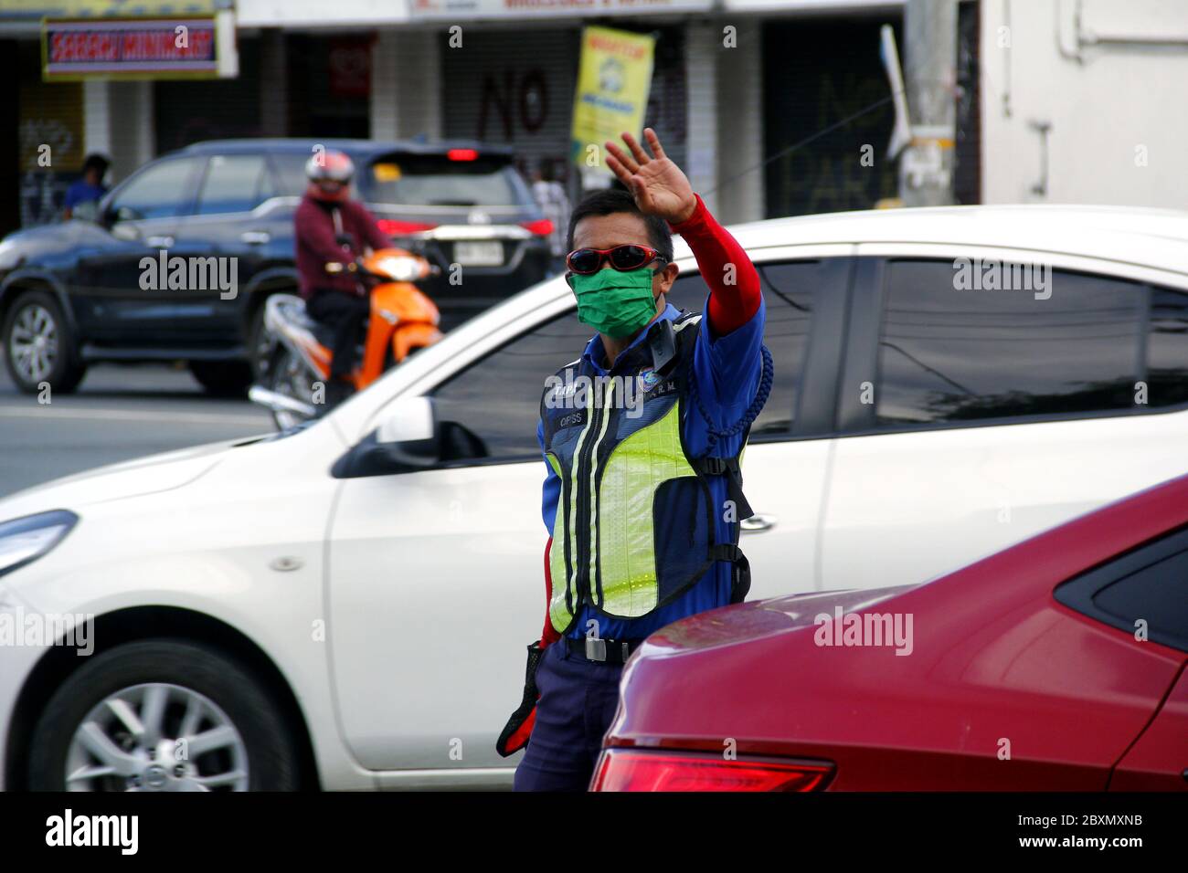 Antipolo City, Philippines - June 1, 2020: Traffic officers direct and ...