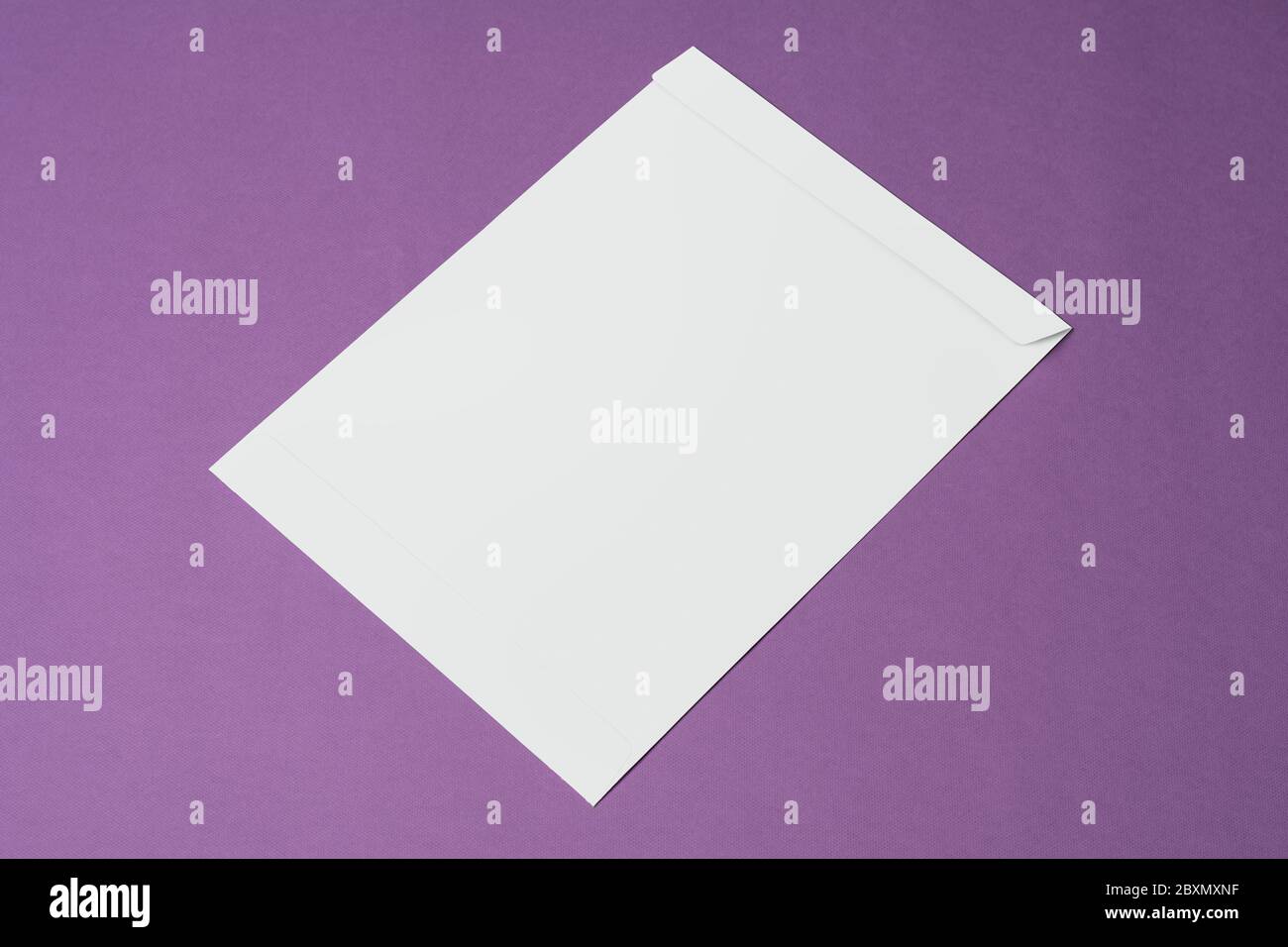 An A4 paper envelope on purple backdrop, editable mock up template for ...