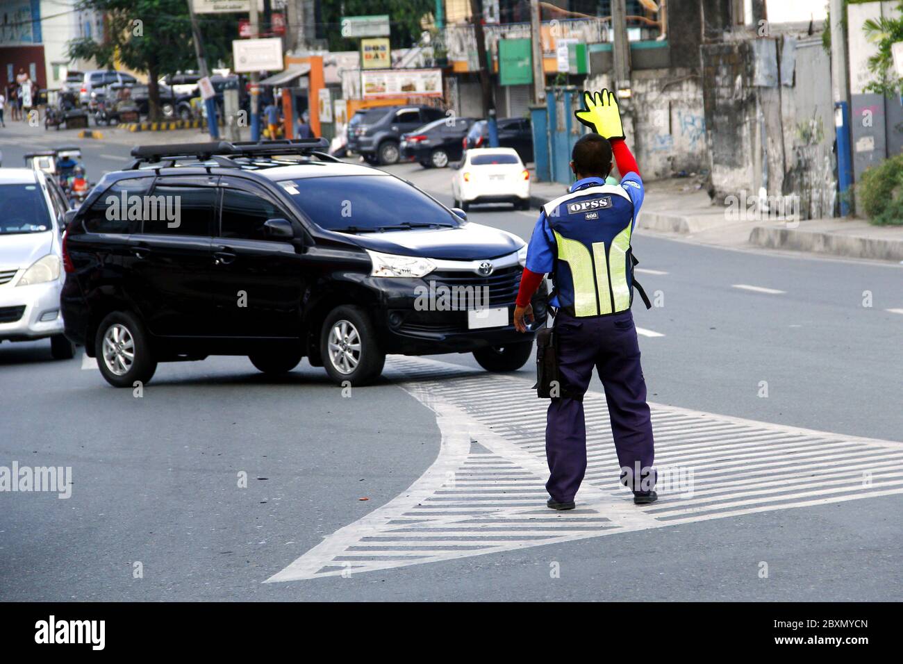Antipolo City, Philippines - June 1, 2020: Traffic officers direct and ...