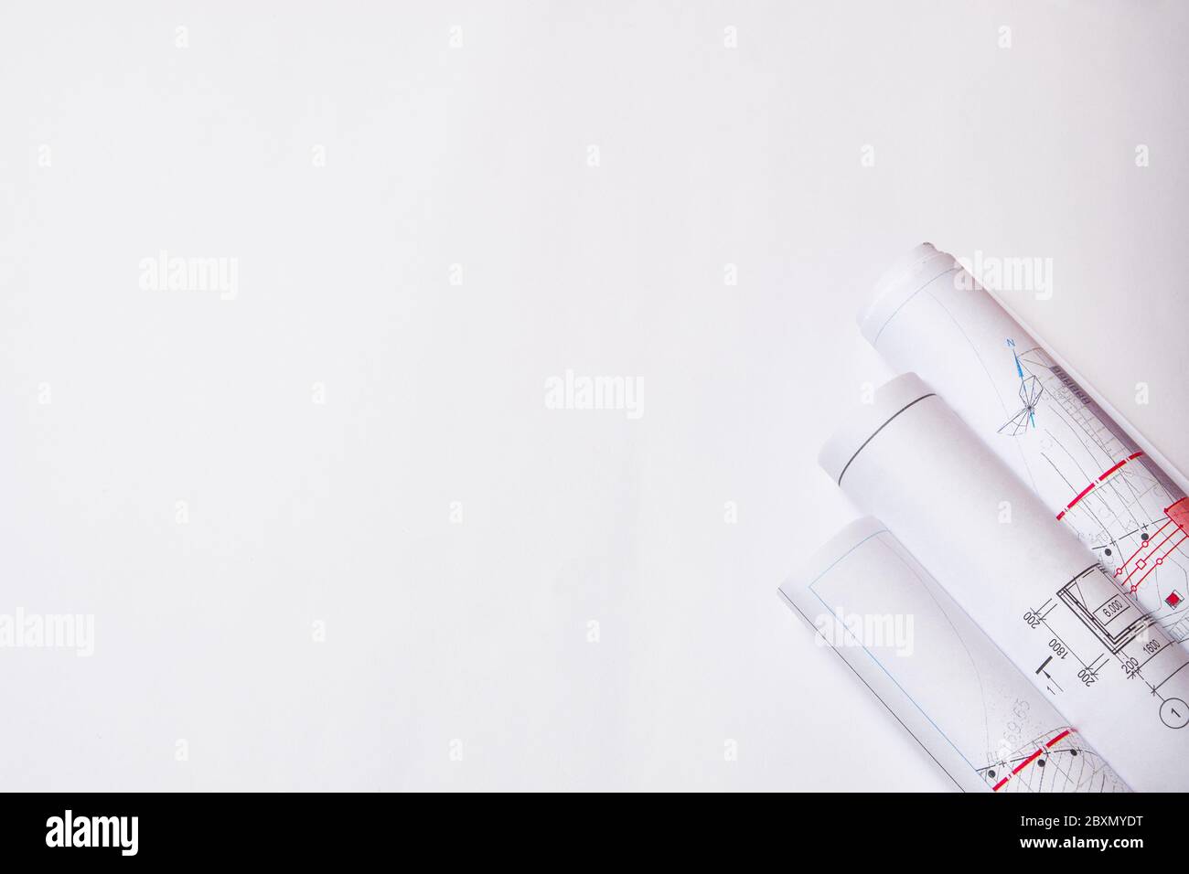 Rolled engineering drawings at white background with copy space Stock ...