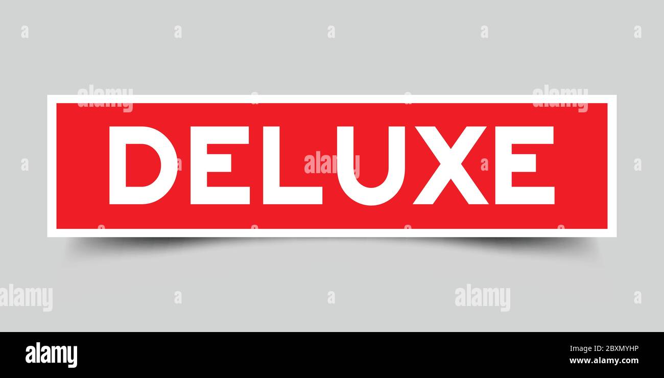 Label sticker in red color square shape as word deluxe on white ...